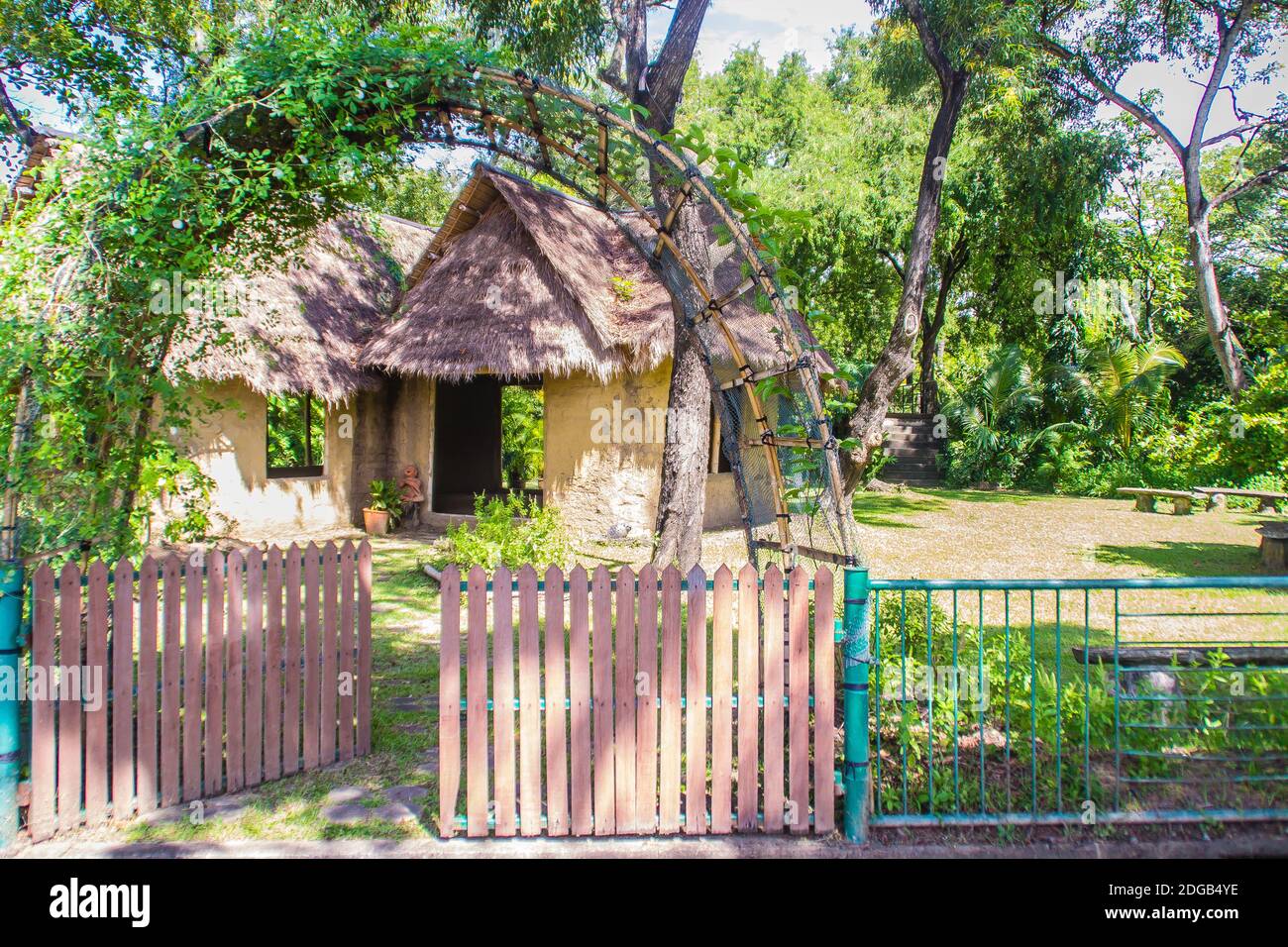 Earthen house under shade of trees. An earth house, also known as earth ...