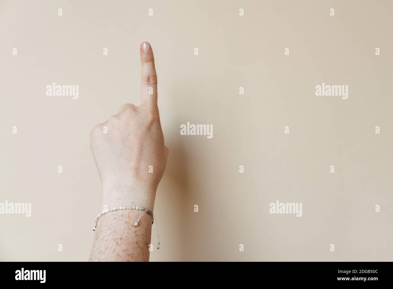 Woman's hand pointing away isolated Stock Photo - Alamy