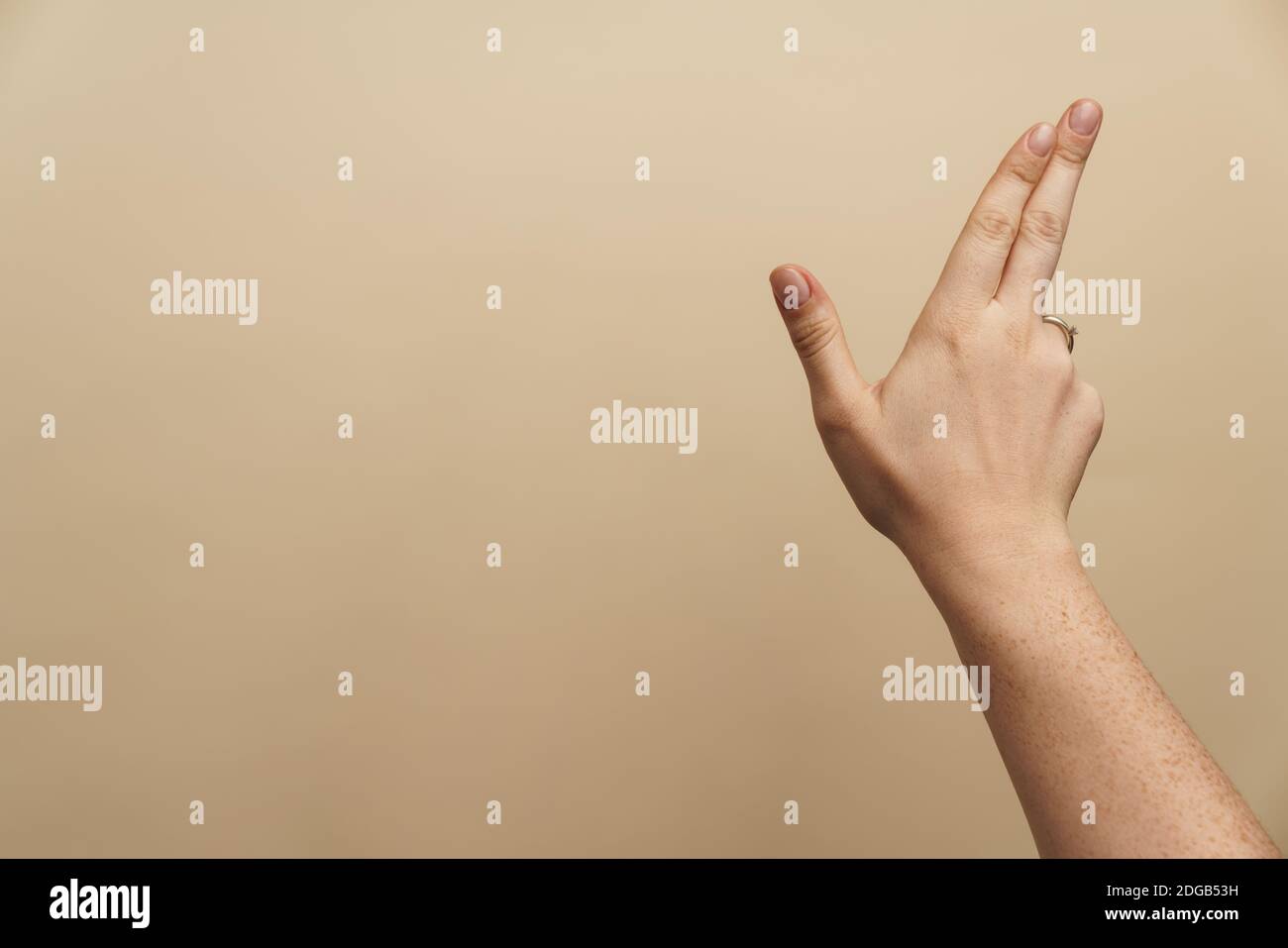 Woman's hand pointing away isolated Stock Photo - Alamy