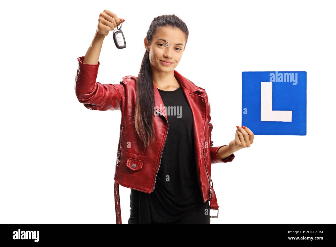 Female driver holding a car key and a learner plate isolated on white ...