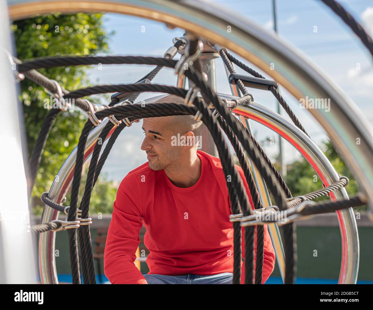Young man relaxing and walking at the park, enjoing life and smiling in ...