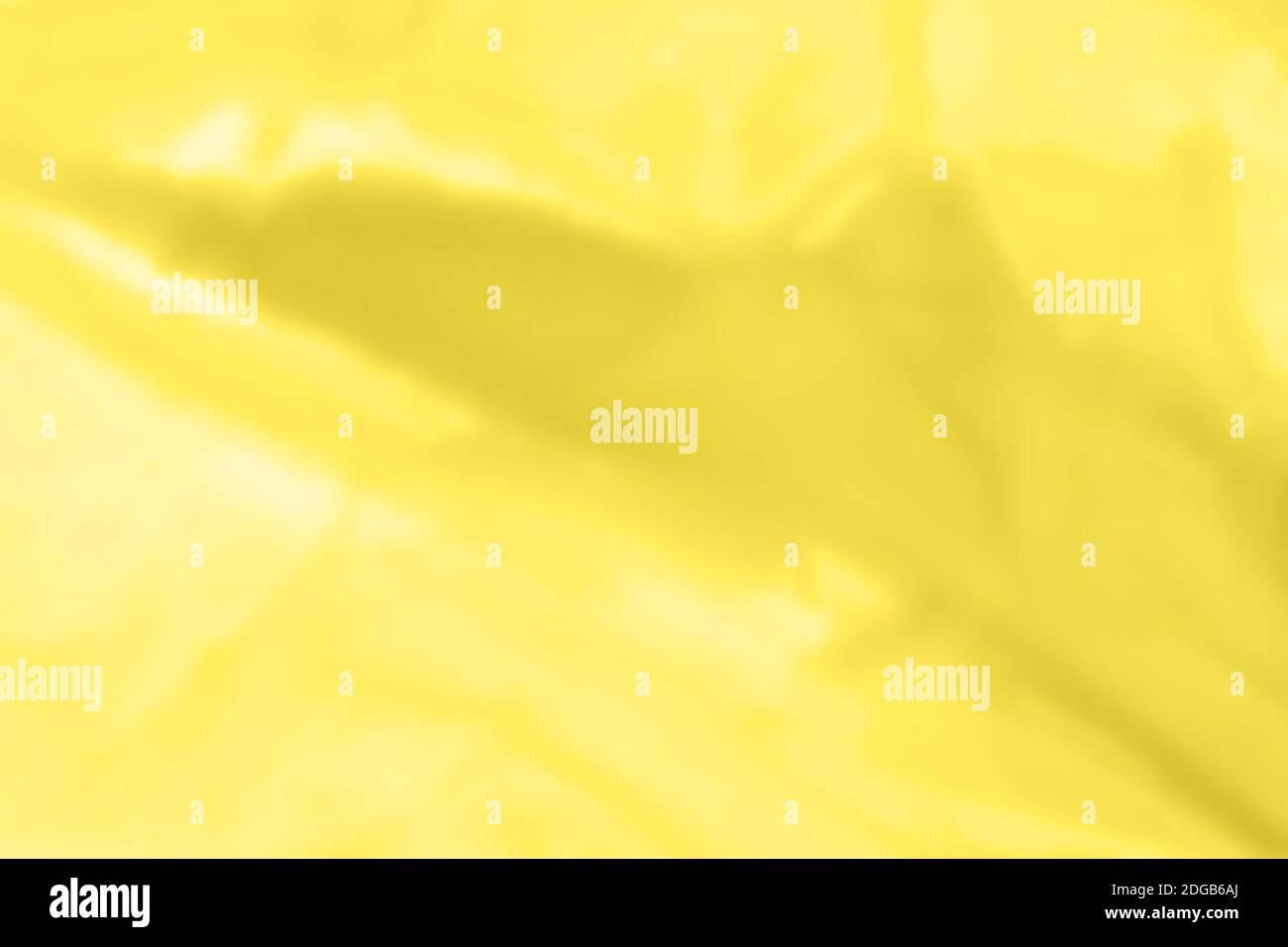 Abstract holographic yellow background. Liquid neon illuminating foil ...