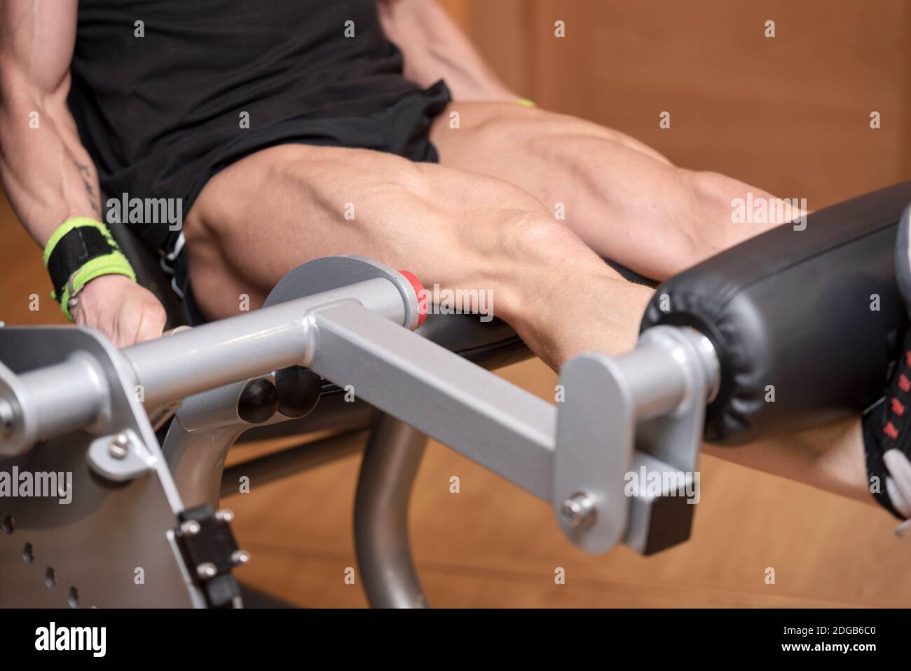 Handsome strong man performed leg press workout in the gym Stock Photo ...