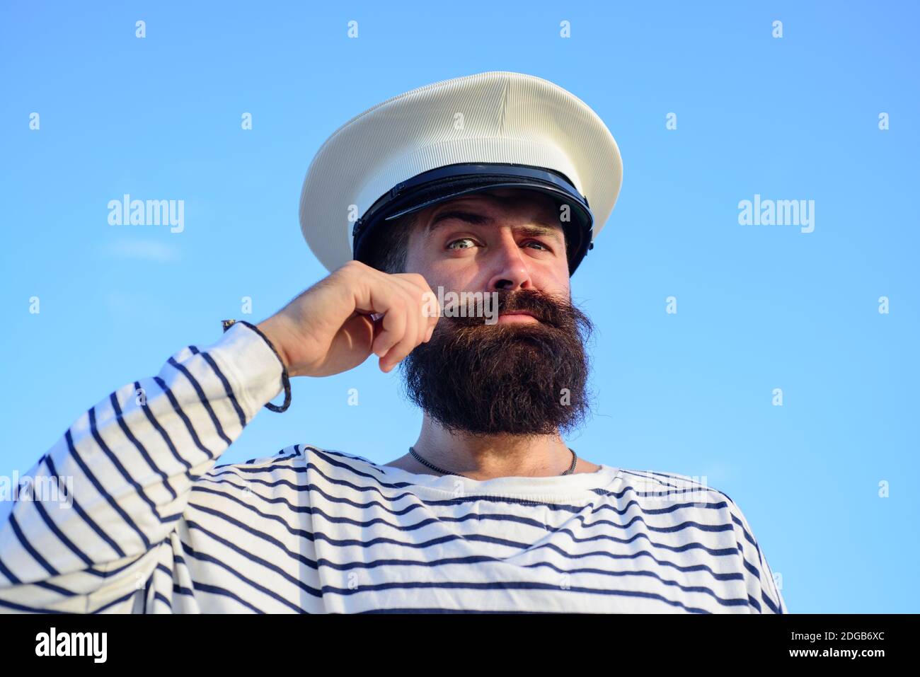 Funny captain sailor wearing hat. Seaman fun. Portrait of serious ...
