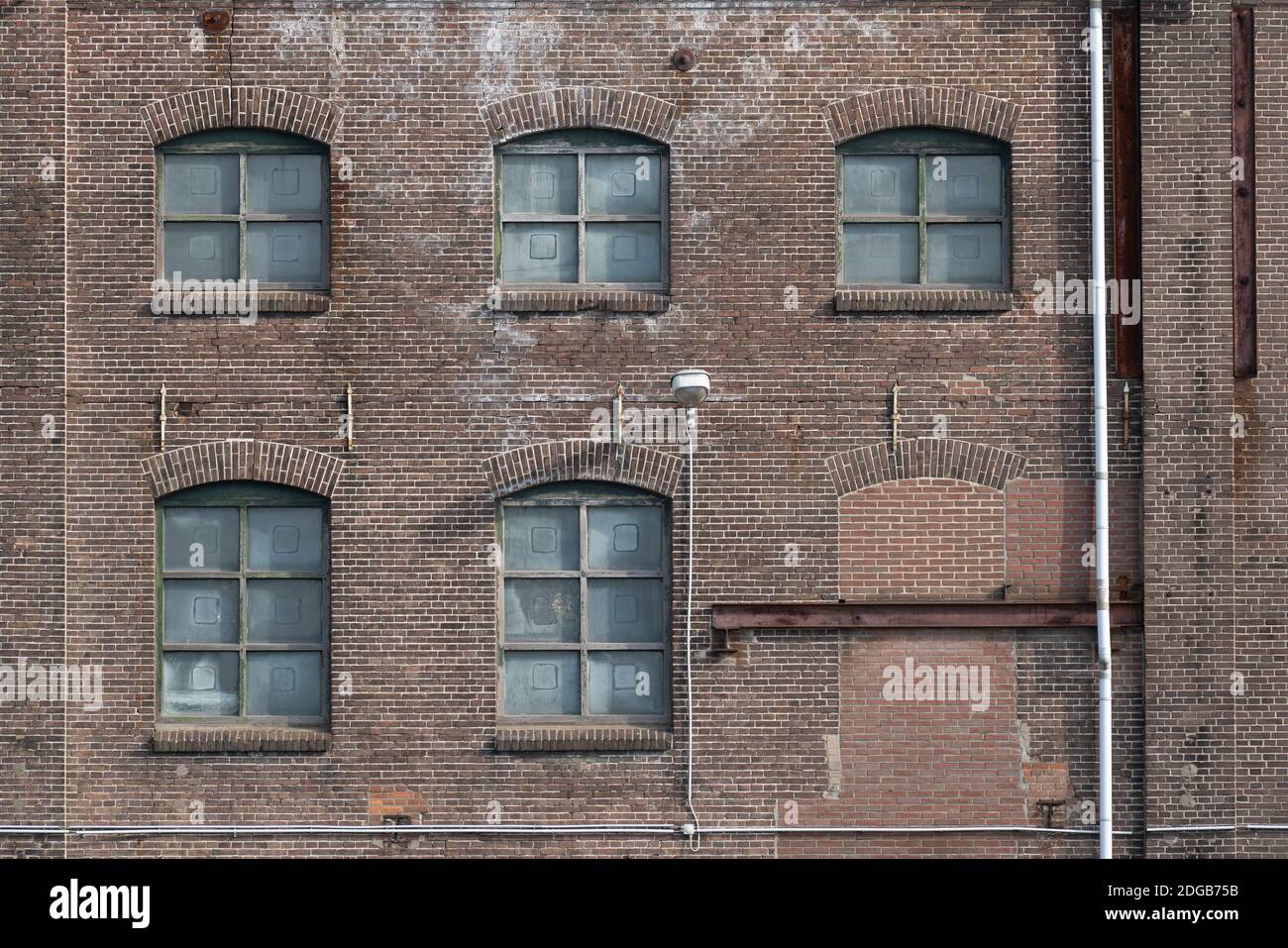 A fragment of an old and weathered facade of an abandoned factory Stock ...