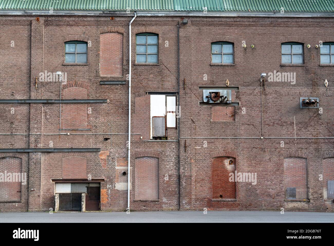 A fragment of an old and weathered facade of an abandoned factory Stock ...