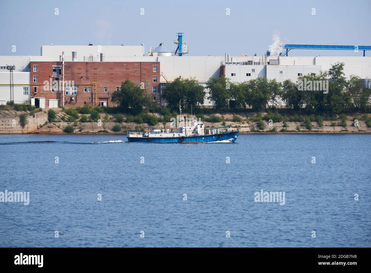 industrial landscape with a factory on the banks of the river, along ...