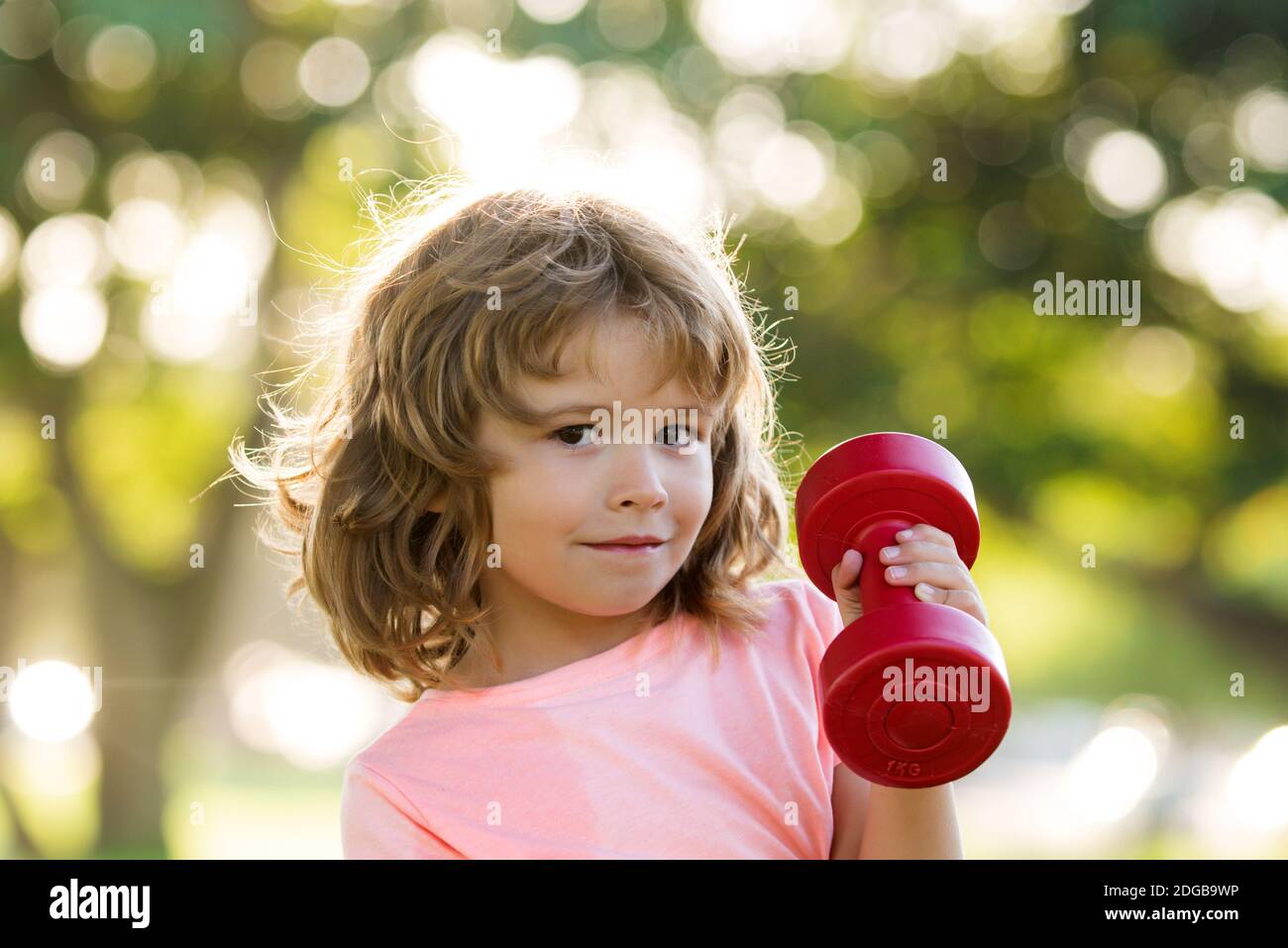 Funny child sport. Kid boy with dumbbells. Kids development and healthy ...