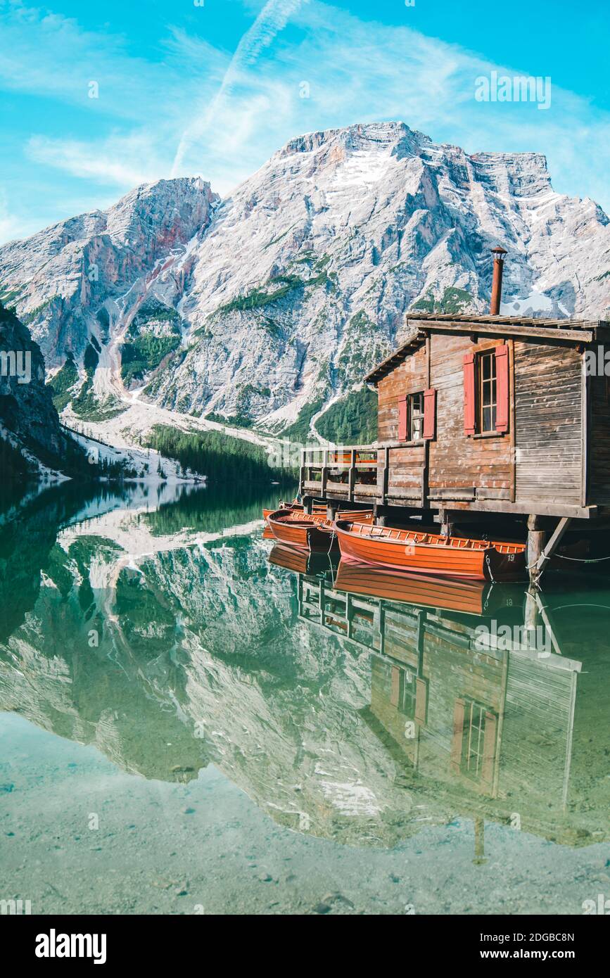 view of wooden boat station at alpine high mountain lake braies pragser ...