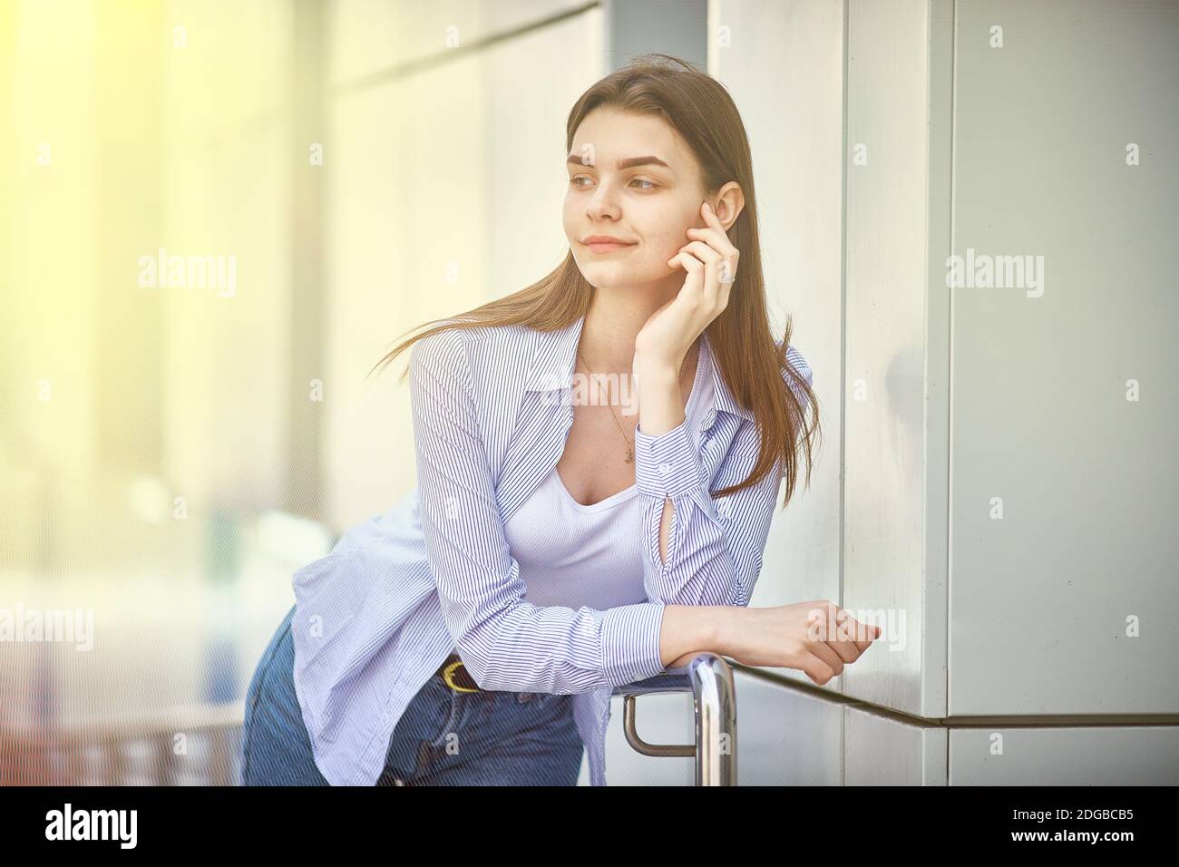 young girl stands near the building Stock Photo - Alamy