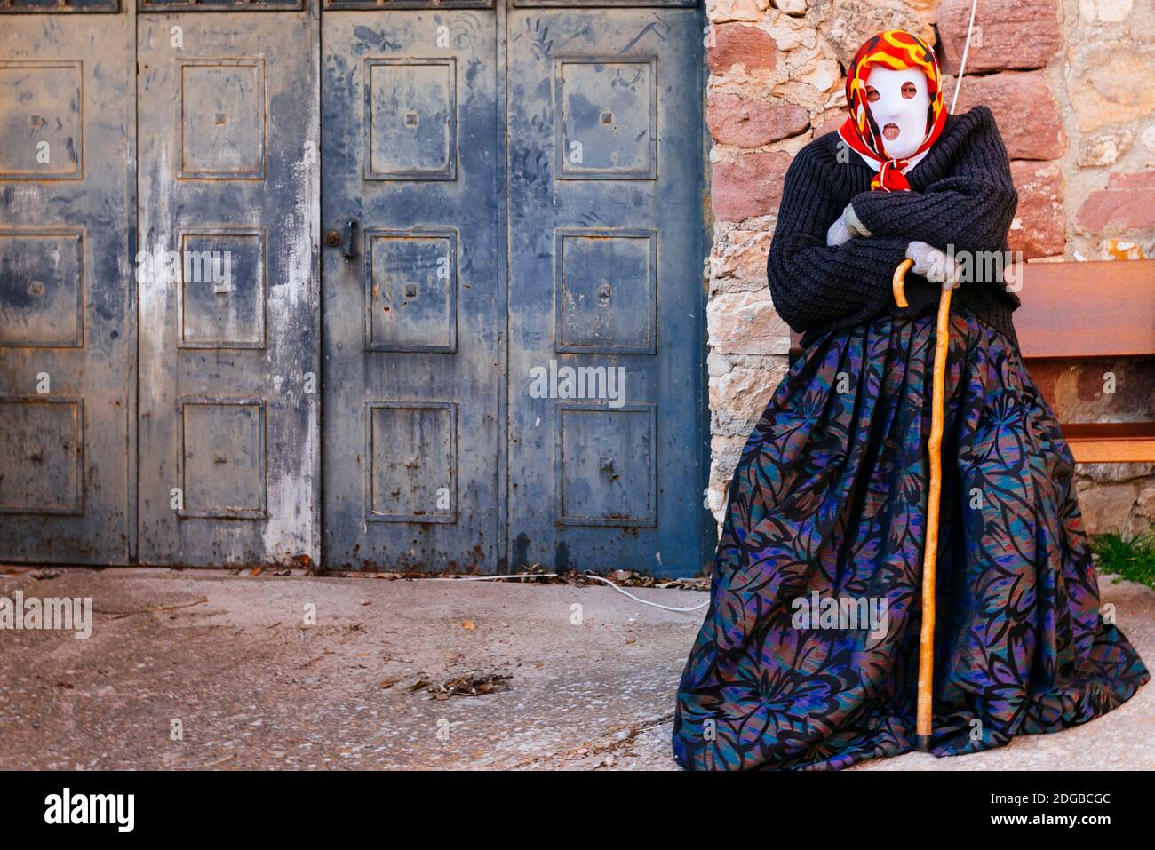 Mascarita - Masked Figure, sitting on a bench waiting for the arrival ...