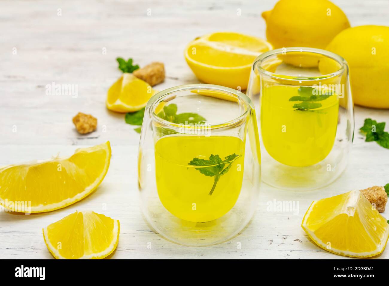 Traditional Italian digestif: liqueur Limoncello with lemons and ...