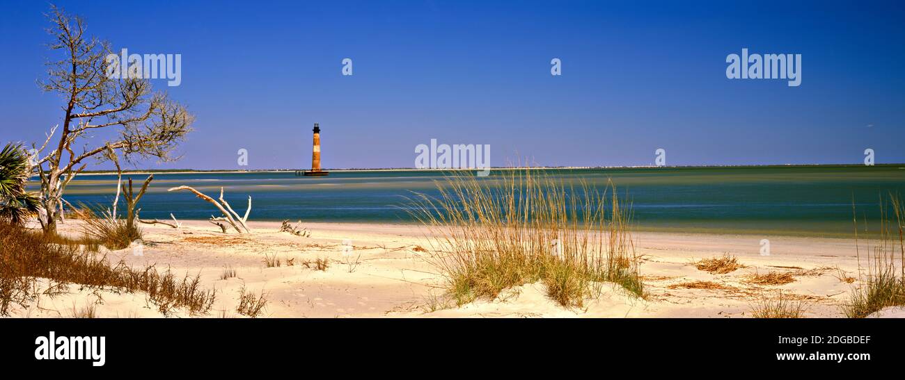 Beach with lighthouse in the background, Morris Island Lighthouse ...