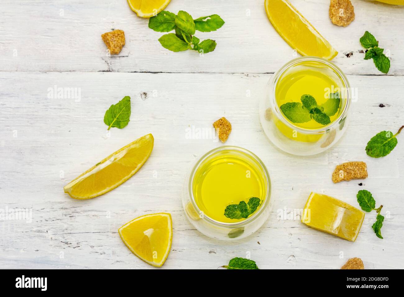 Traditional Italian digestif: liqueur Limoncello with lemons and ...