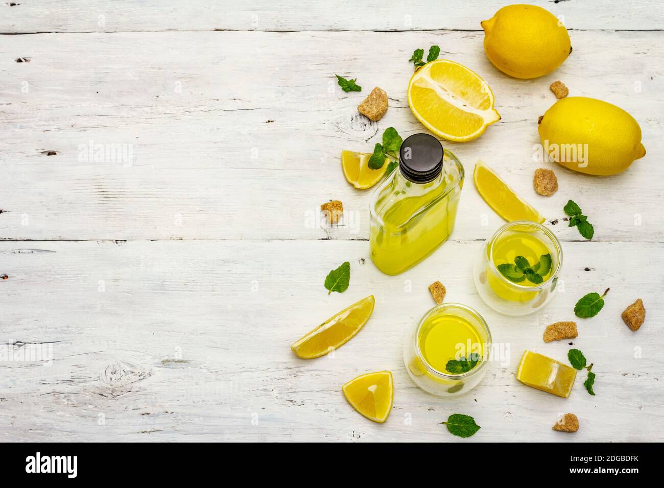 Traditional Italian digestif: liqueur Limoncello with lemons and ...