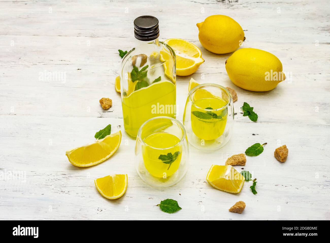 Traditional Italian digestif: liqueur Limoncello with lemons and ...