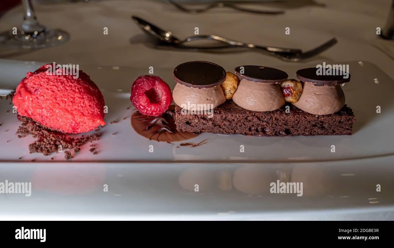 Chocolate cake with raspberry, hazelnut and ice cream. Delicious ...