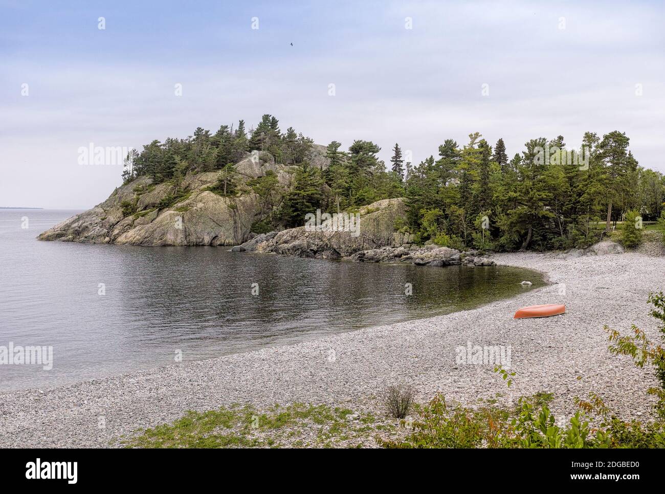Rugged cliffs and pebble beach at the north shore of Lake Superior ...