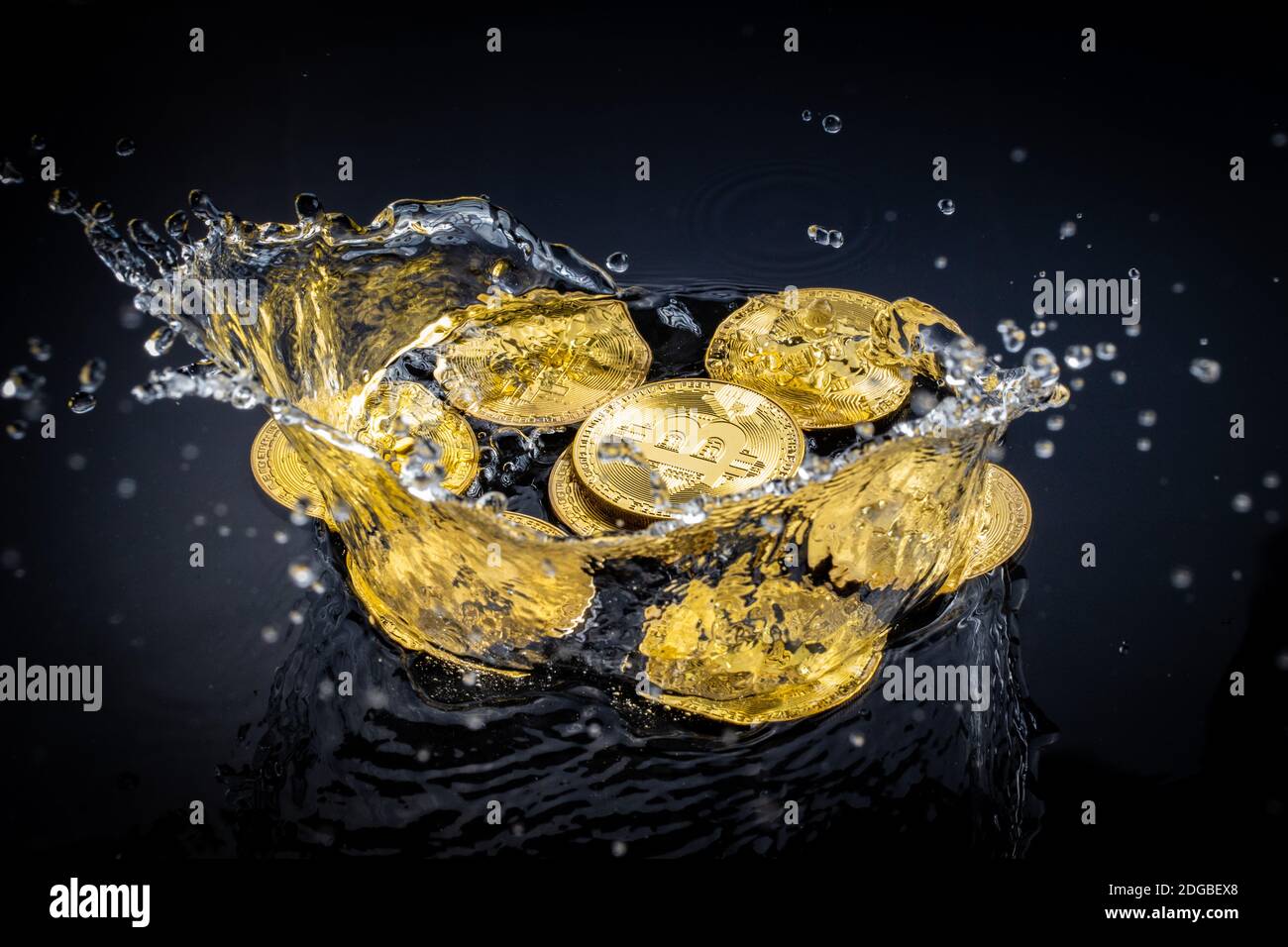 Gold bitcoin coin falling to water. Bitcoin and water splash Stock ...