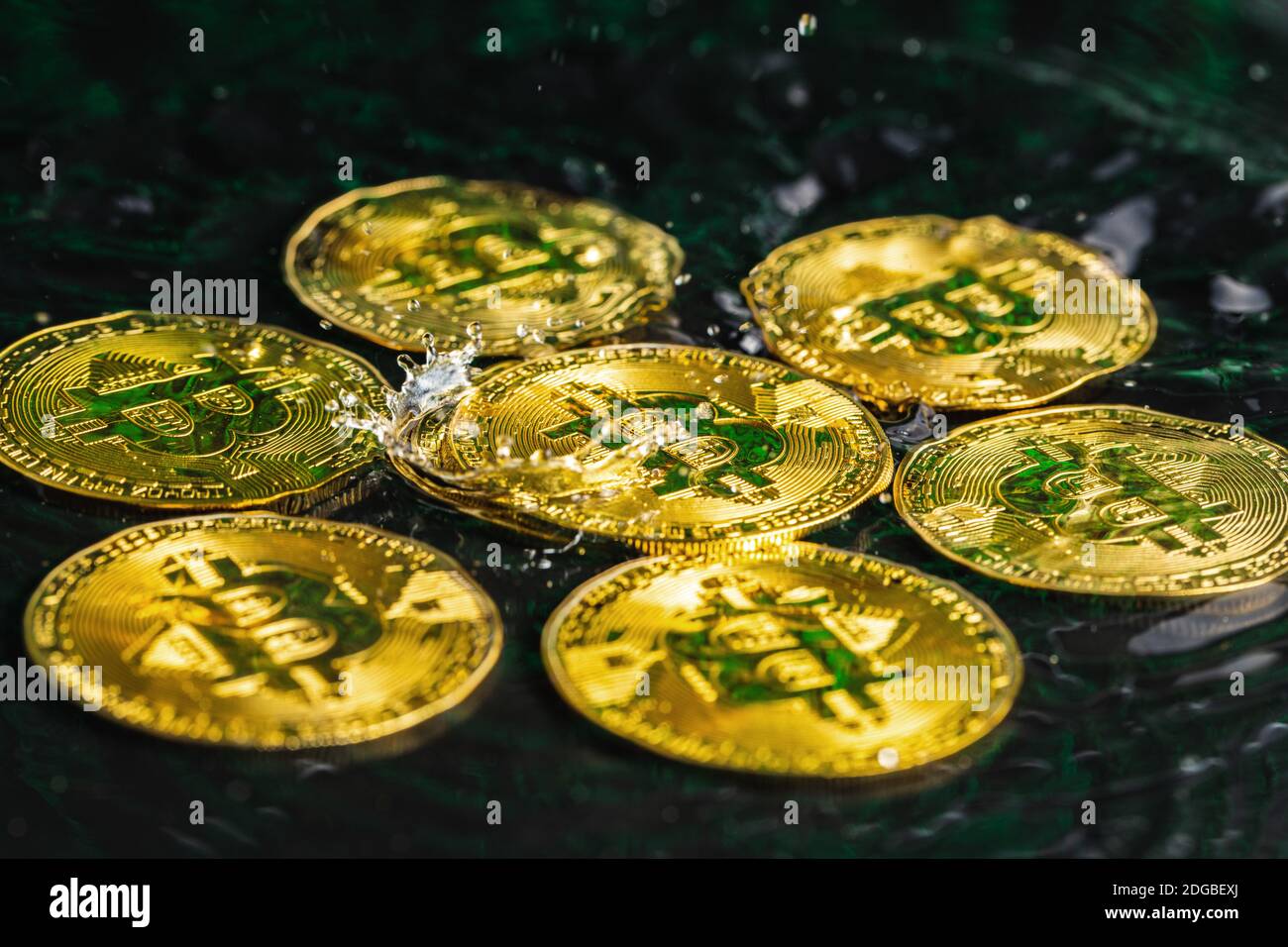 Gold bitcoin coin falling to water. Bitcoin and water splash Stock ...