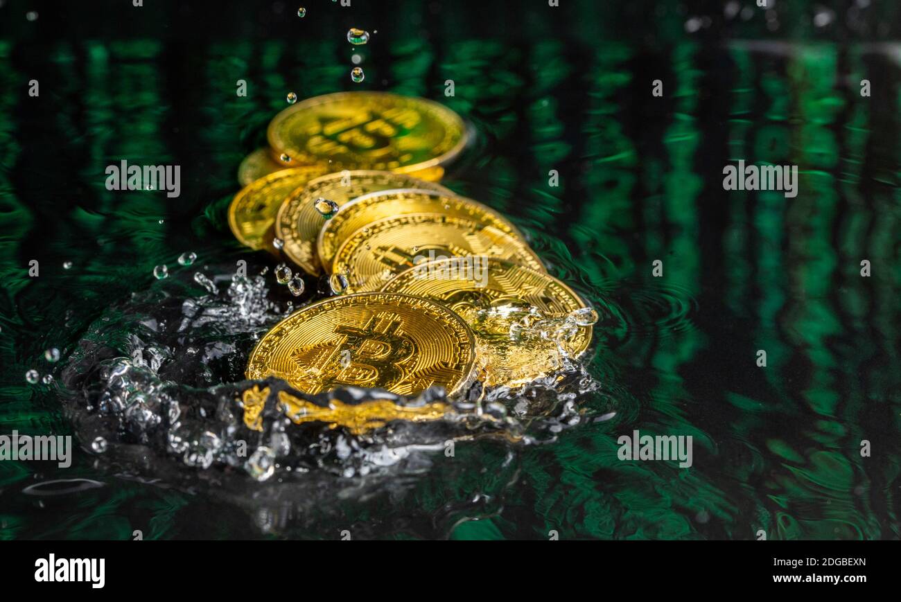 Gold bitcoin coin falling to water. Bitcoin and water splash Stock ...