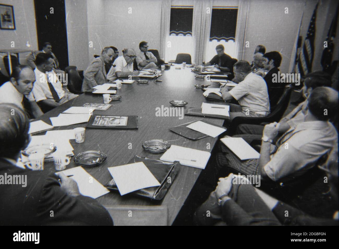 Fine 1970s vintage black and white photography of a business meeting ...