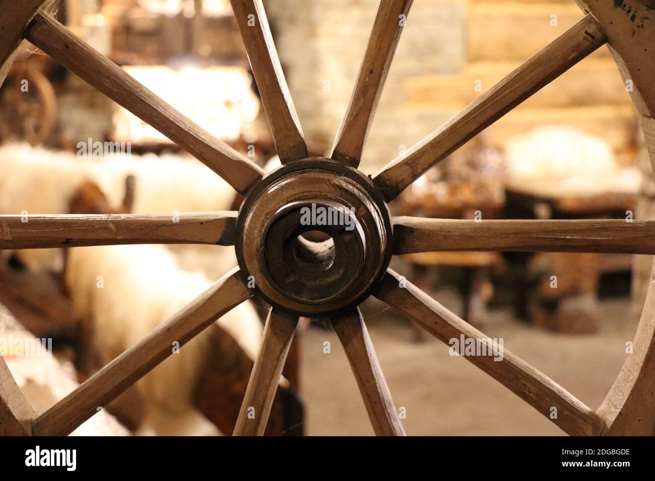 Closeup view of an wooden wheel with spokes Stock Photo - Alamy