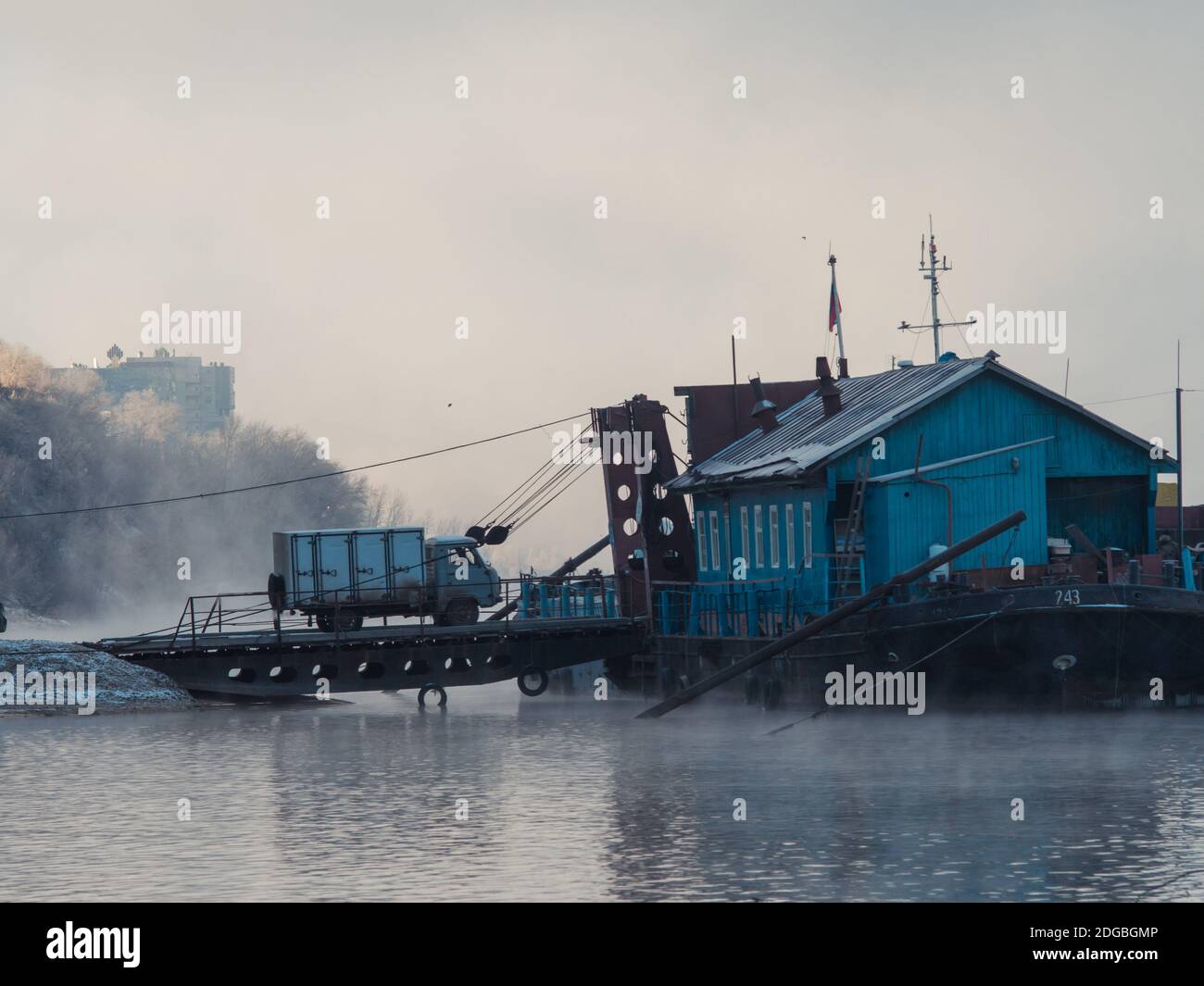 Car loaded in self-propelled ferry boat on the winter river Stock Photo ...