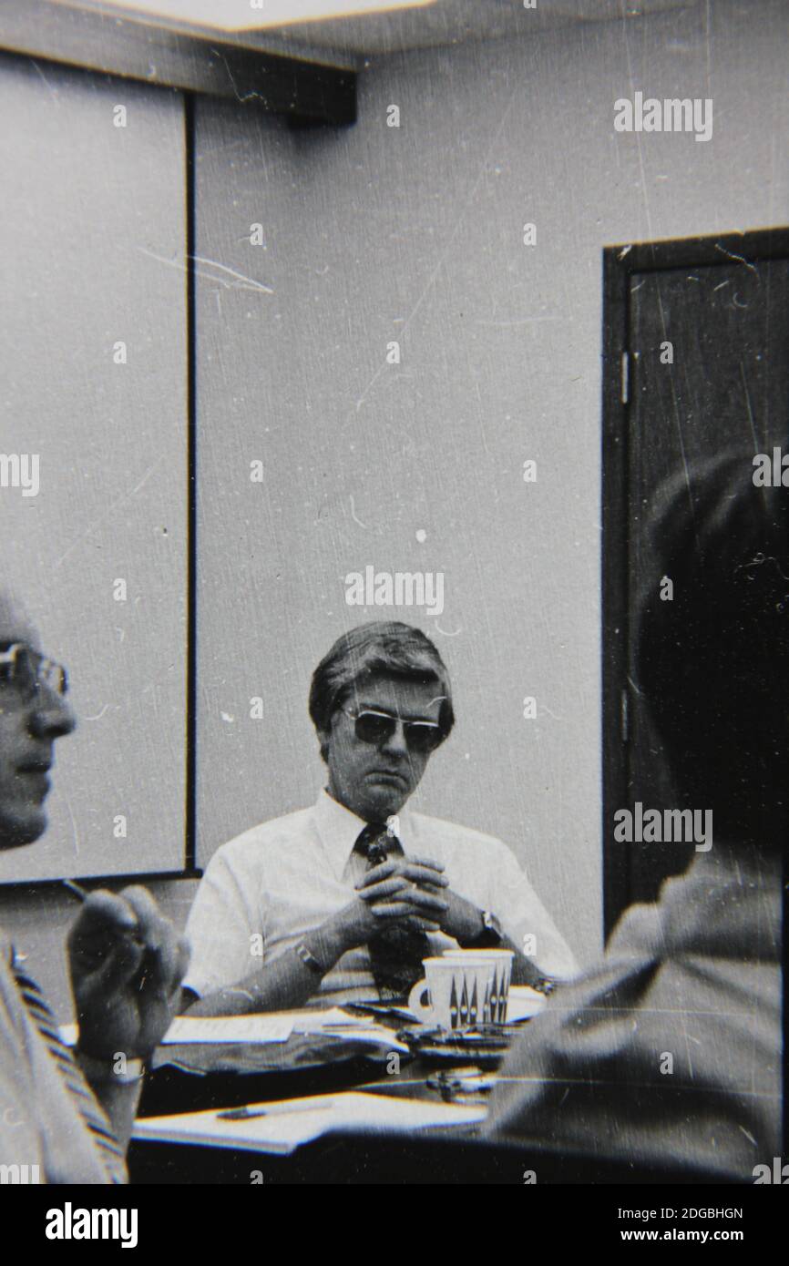 Fine 1970s vintage black and white photography of a business meeting ...
