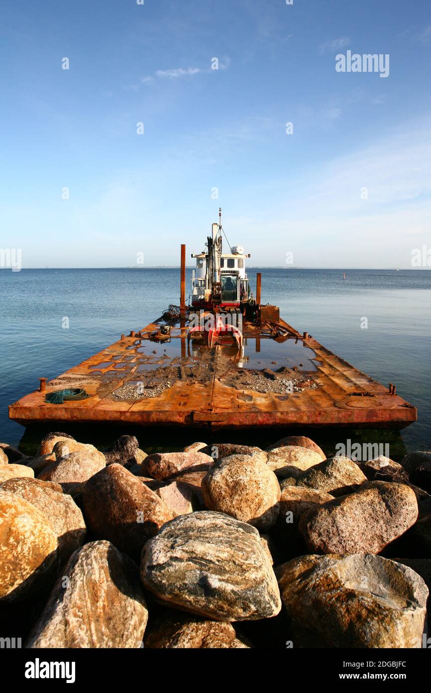 Boat with bulldozer Stock Photo - Alamy