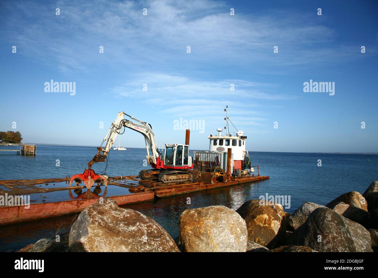 Boat with bulldozer Stock Photo - Alamy