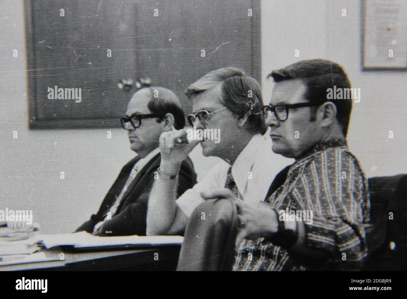 Fine 1970s vintage black and white photography of a business meeting ...