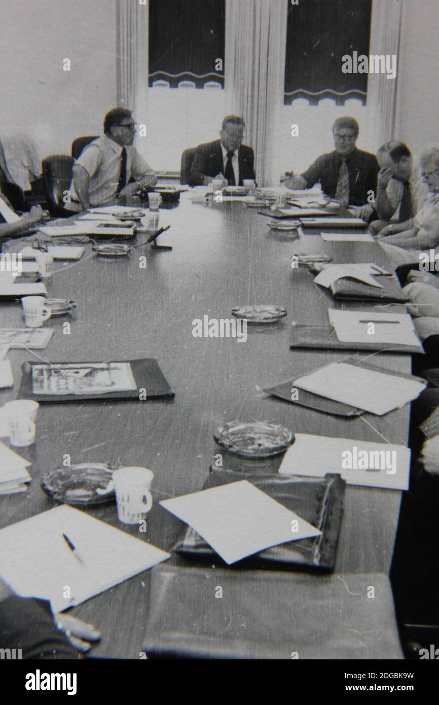 Fine 1970s vintage black and white photography of a business meeting ...