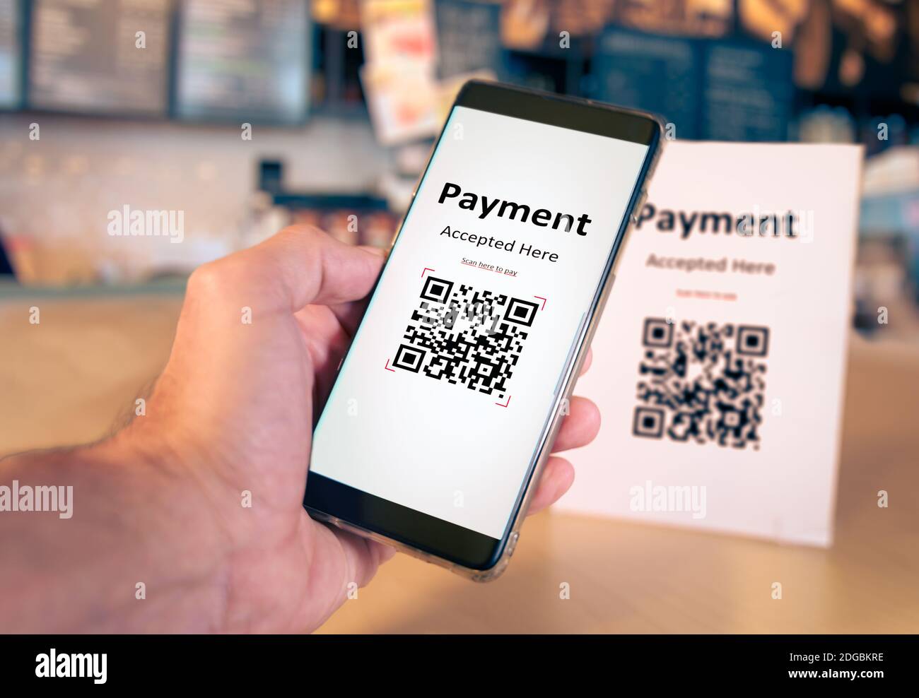 Qr code payment or cashless technology concept. Coffee shop accepting ...