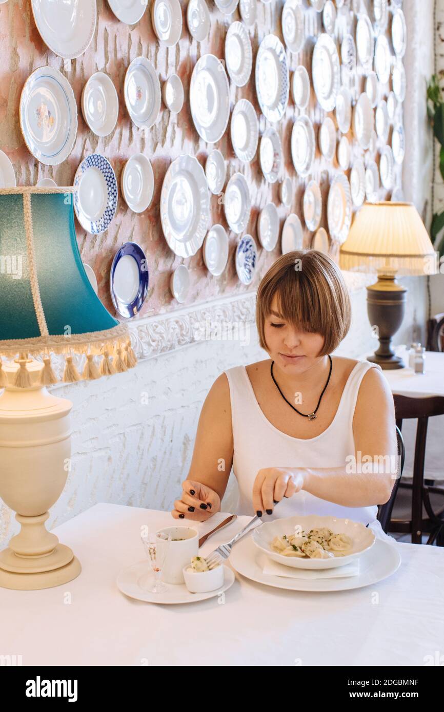 Sitting table eating women hi-res stock photography and images - Alamy