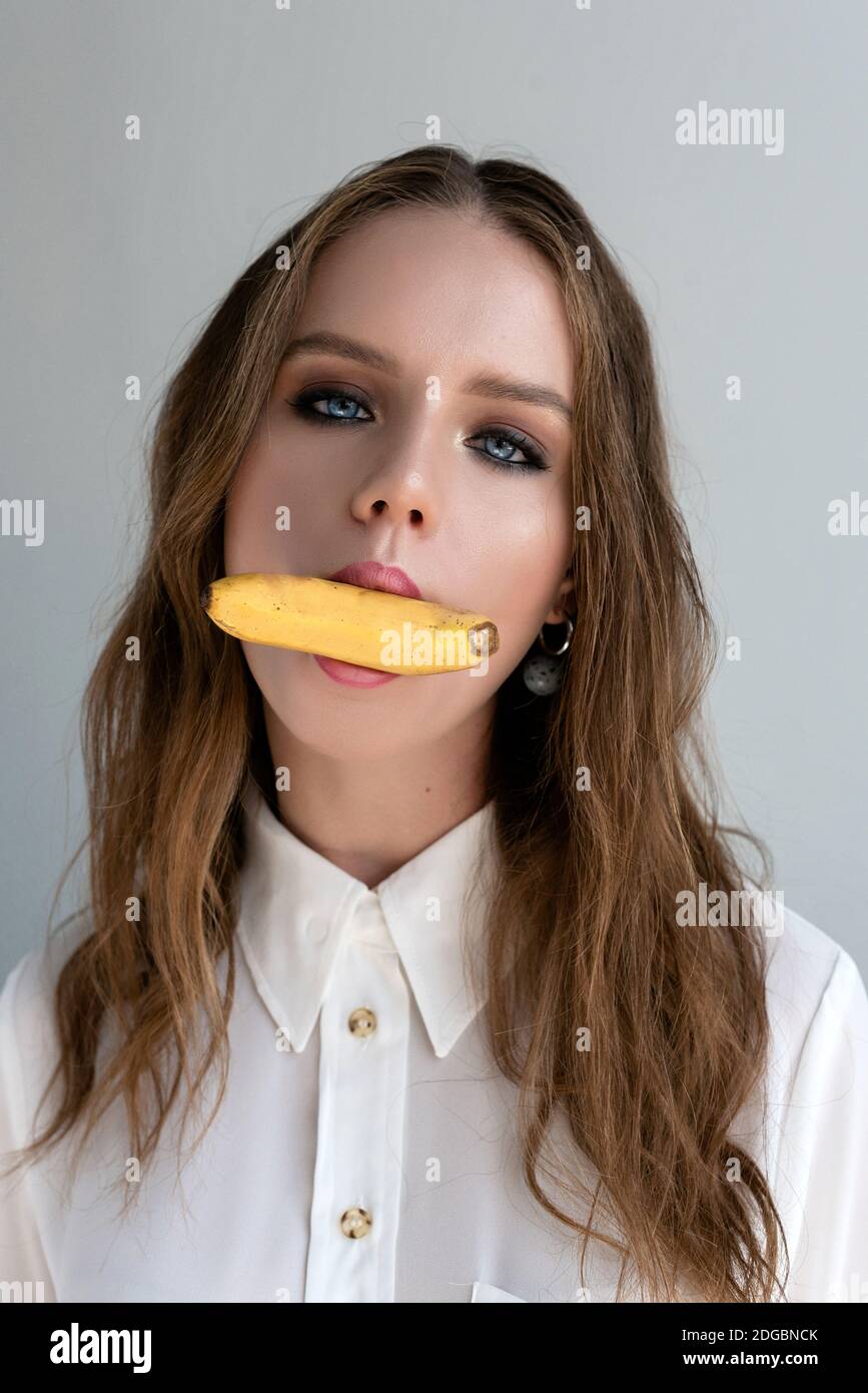 Banana in the mouth hi-res stock photography and images - Alamy