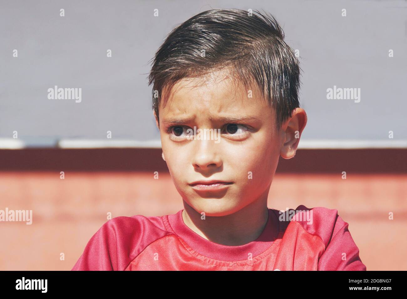 Portrait of a serious looking boy Stock Photo - Alamy