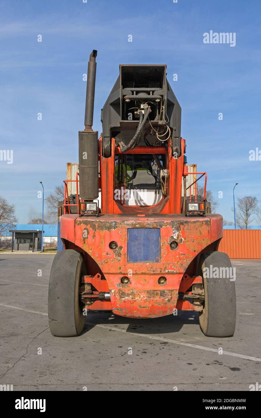 Reach Stacker Lifting Cargo Container at Terminal Yard Stock Photo - Alamy