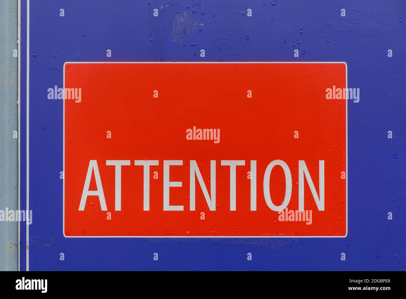 Big Red Sign Attention Warning Caution at Wall Stock Photo - Alamy