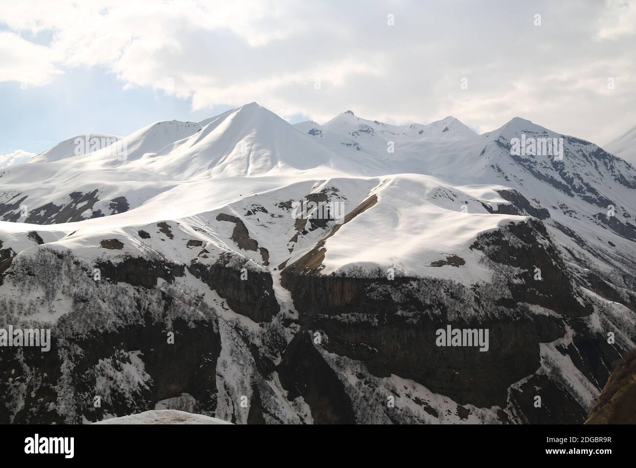 The mountain and the monument in the caucasus Stock Photo - Alamy