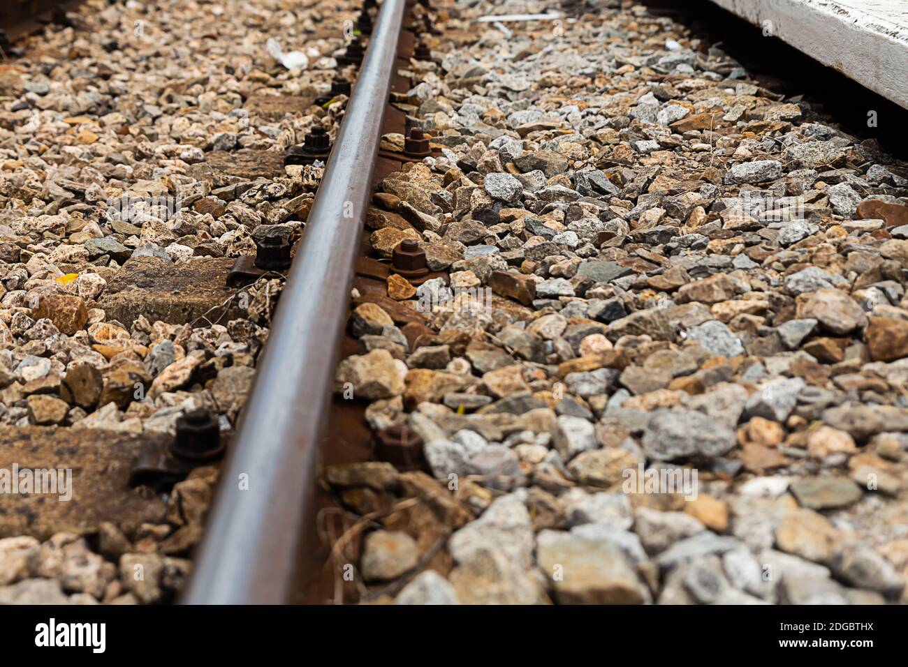 Old iron rail abandoned railroad tracks on a gravel background Stock ...