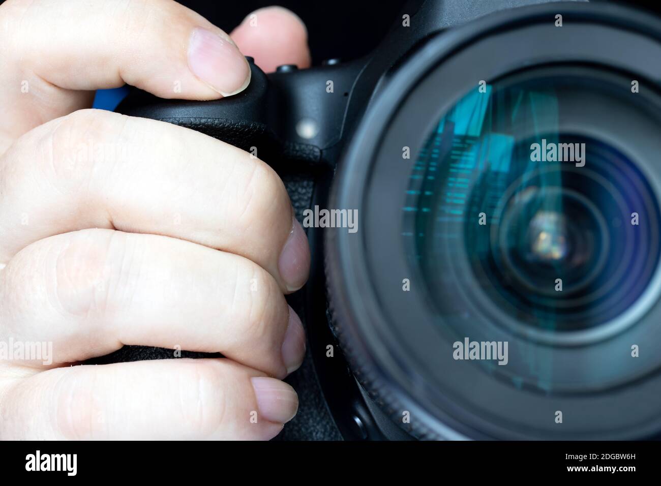 A pressing the shot button of a camera, close up. A take a picture ...