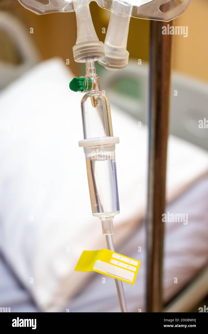 Close up saline solution drip for patient at hospital room, a empty ...