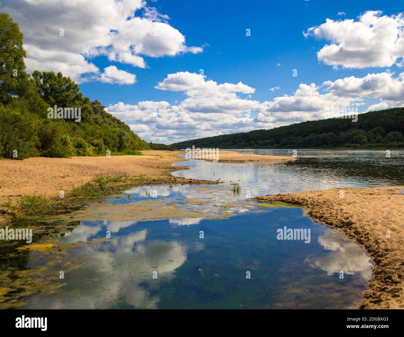 Landscape on a wide river ending with swamps with sandy shoals and ...