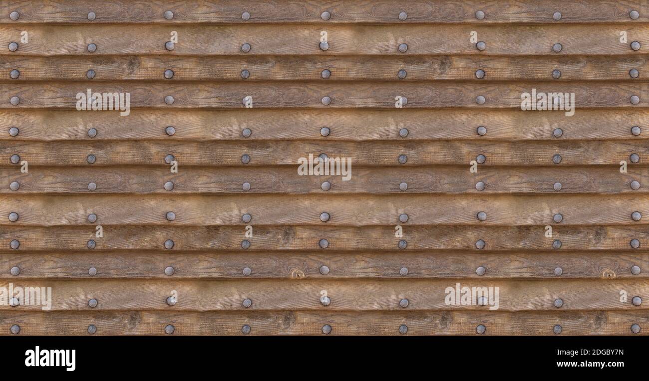 Background horizontal old brown boards with copper rivets in a row ...