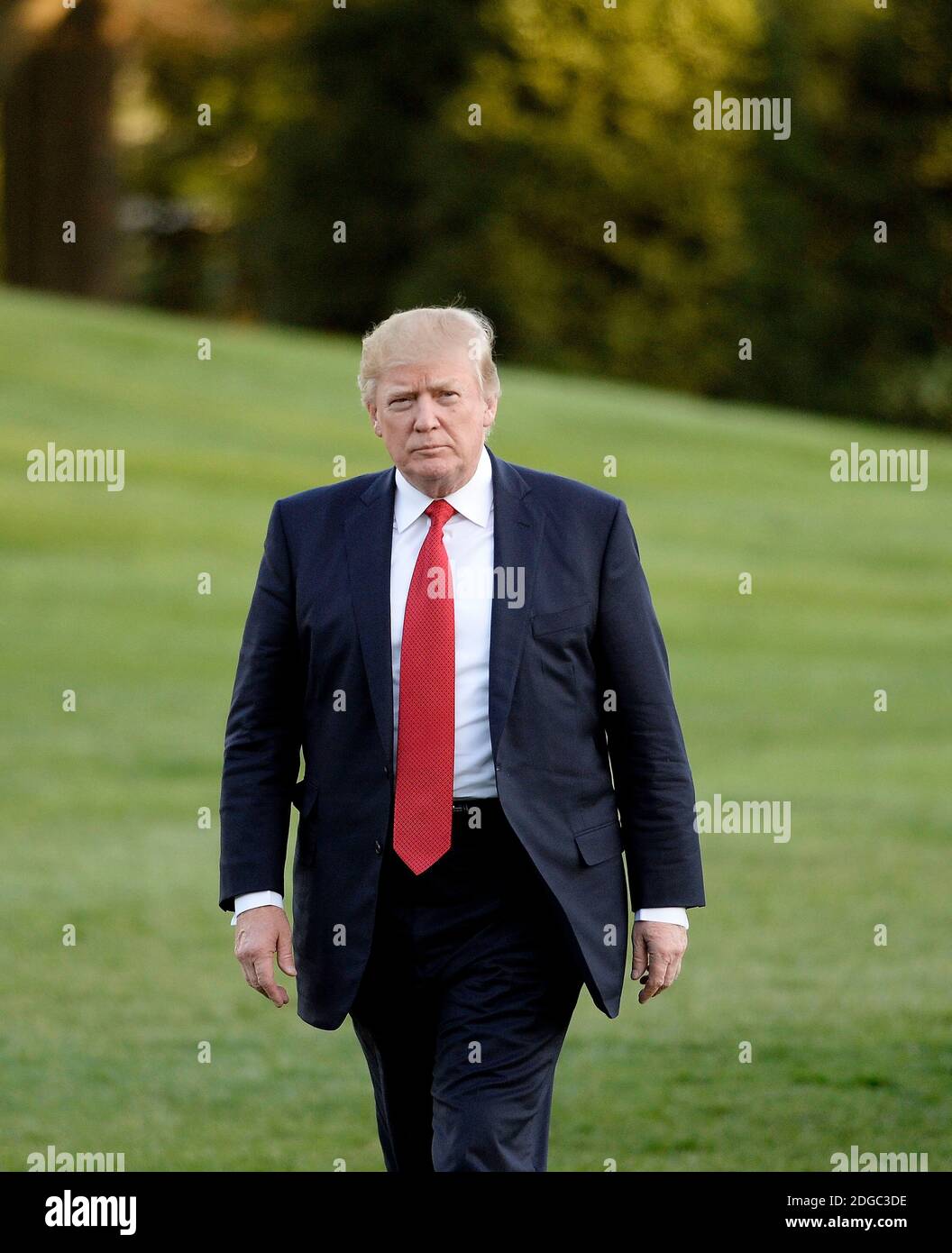 US President Donald Trump walks on the south Lawn after arriving at the ...