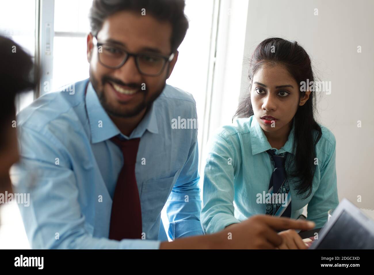 Corporate board meeting in Indian office between young and energetic ...