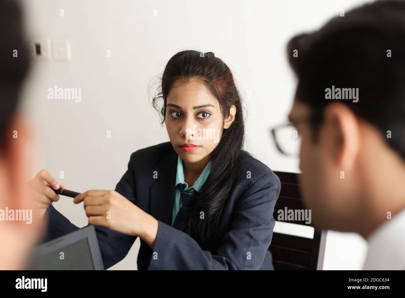 Young and energetic subordinates are discussing with female boss in ...