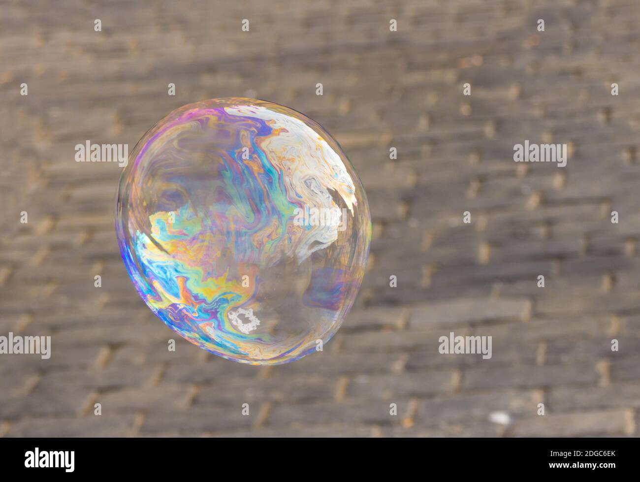 Soap bubble large iridescent with an iridescent pattern close-up ...