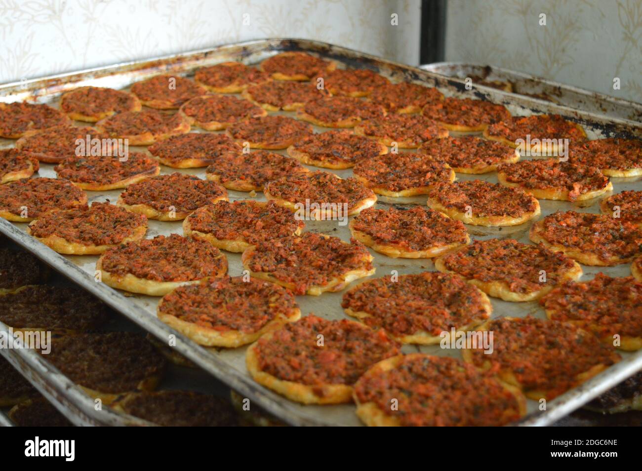 Little lahmacuns, very thin Turkish pizza covered with seasoned minced ...